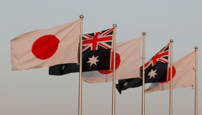 Australia and Japan sign a defense and security cooperation treaty at a ...